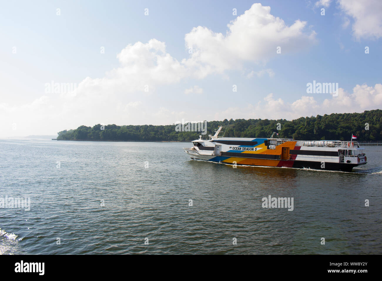 BATAM, INDONESIA - 12 DECEMBER 2018: Ferry and ships transporting ...