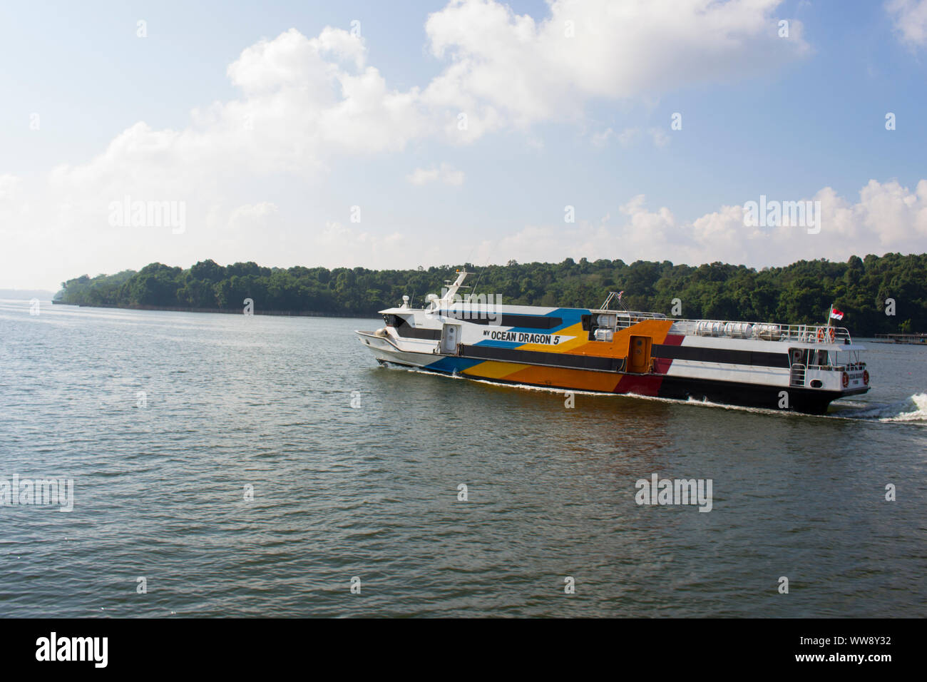 BATAM, INDONESIA - 12 DECEMBER 2018: Ferry and ships transporting ...