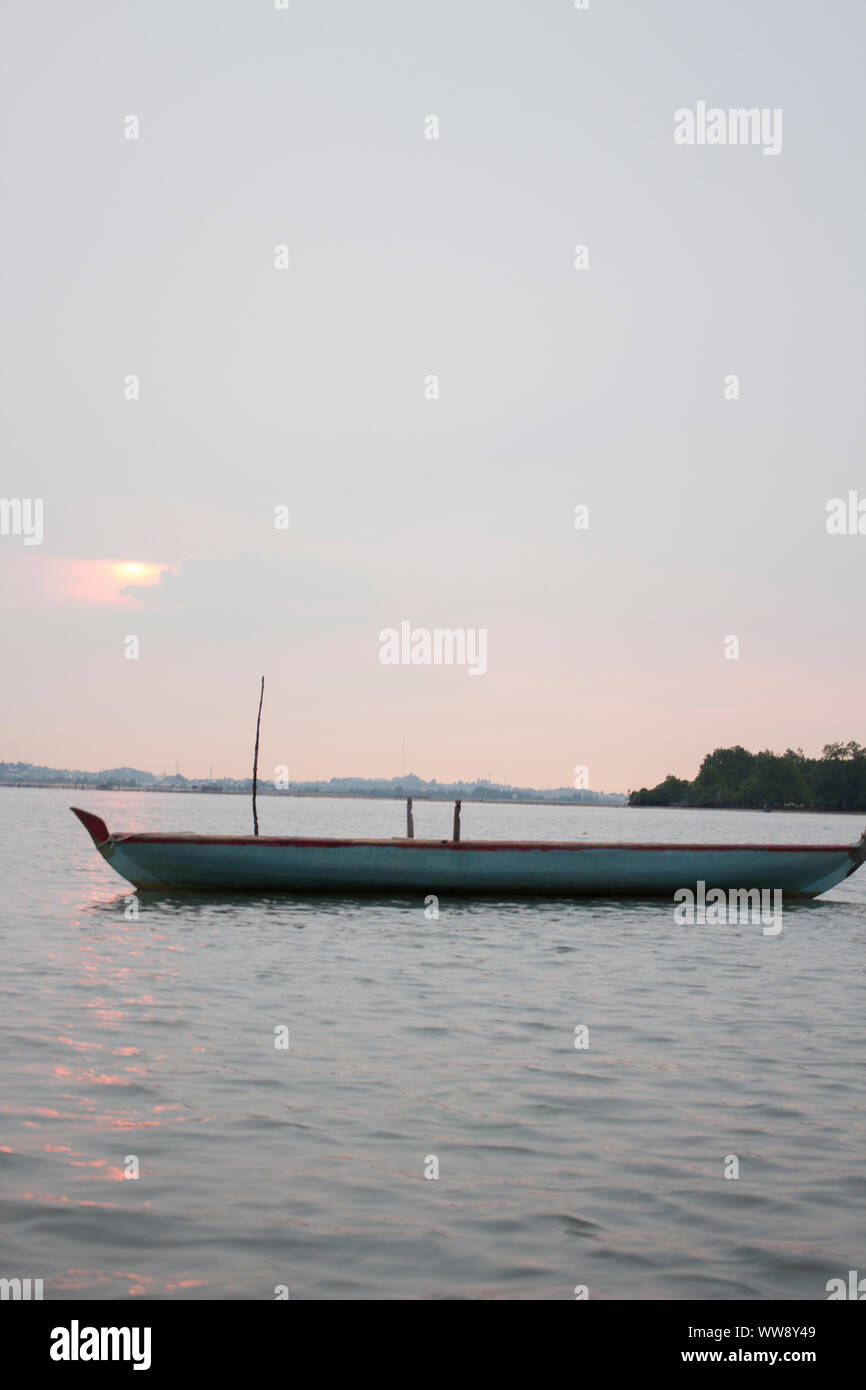POV for boat sailing in river in Batam, Indonesia during sunset and ...