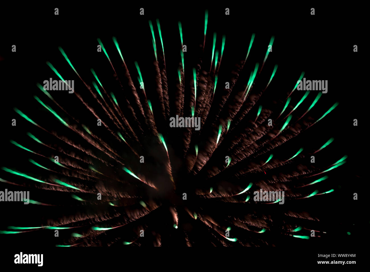 Night burst of beautiful firework celebration with colorful glow ...
