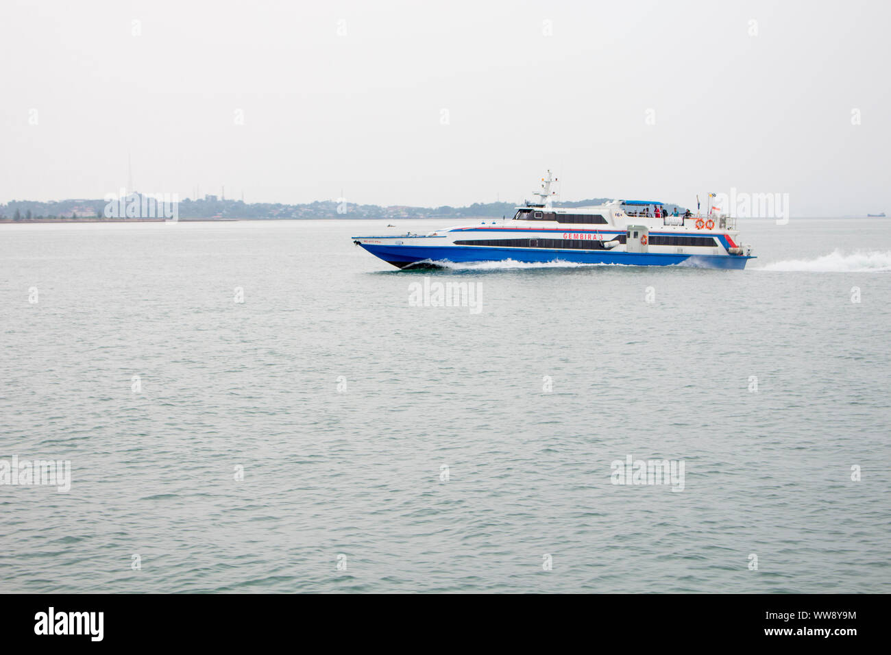 BATAM, INDONESIA - 12 DECEMBER 2018: Ferry and ships transporting ...