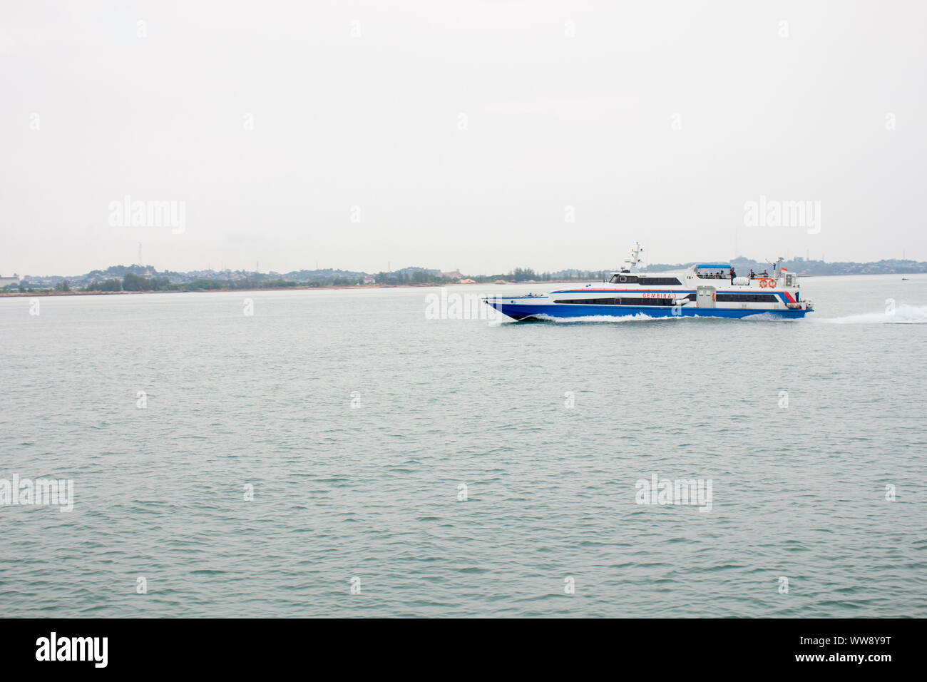 BATAM, INDONESIA - 12 DECEMBER 2018: Ferry and ships transporting ...