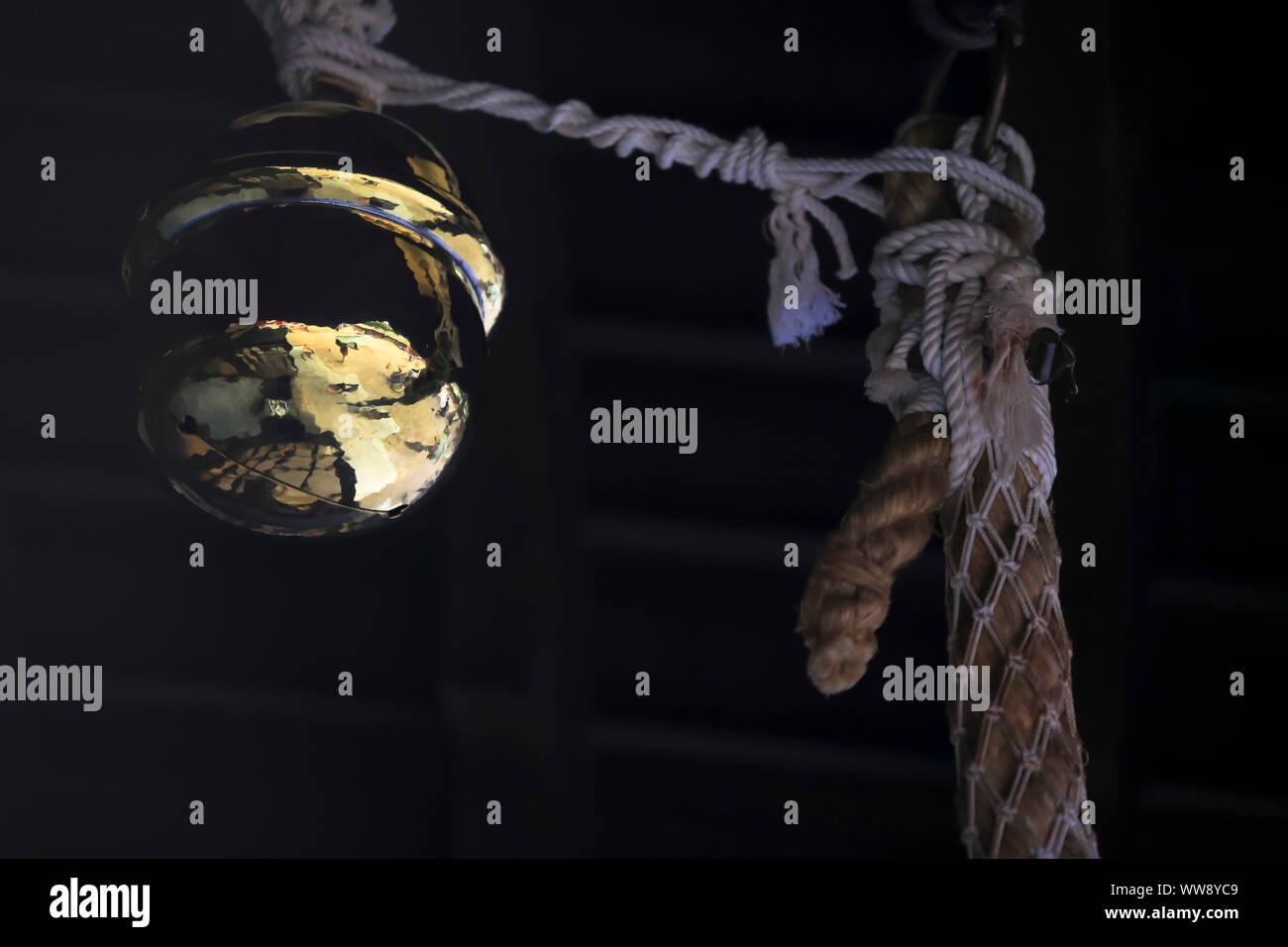 Traditional japanese temple golden wishing bell on rope with shiny ...