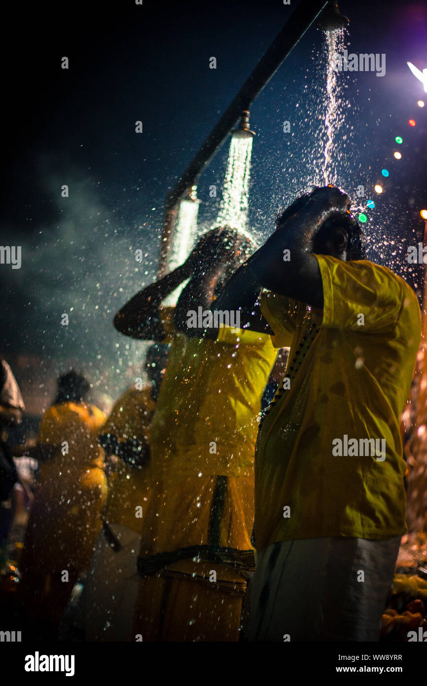 Bath ritual of Hindu devotee during the Thaipusam festival in Malaysia ...