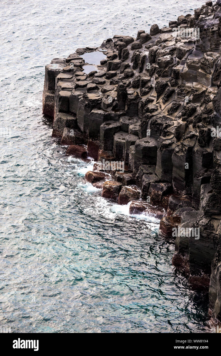 Volcanic pillar cliff near sea shore seaside in Jusangjeolli Seogwipo ...