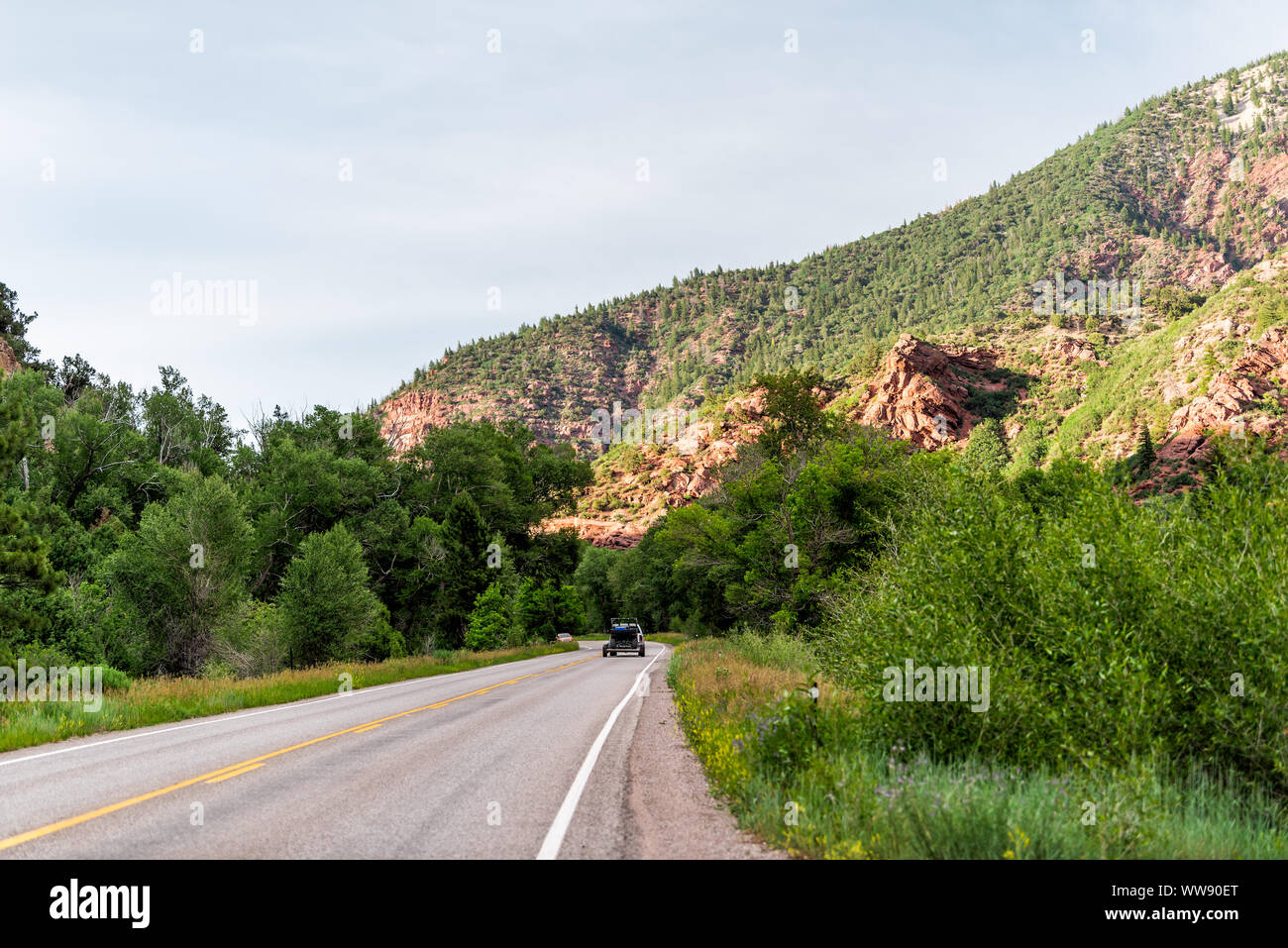 View of rocky red cliff from road Highway 133 in Redstone, Colorado ...