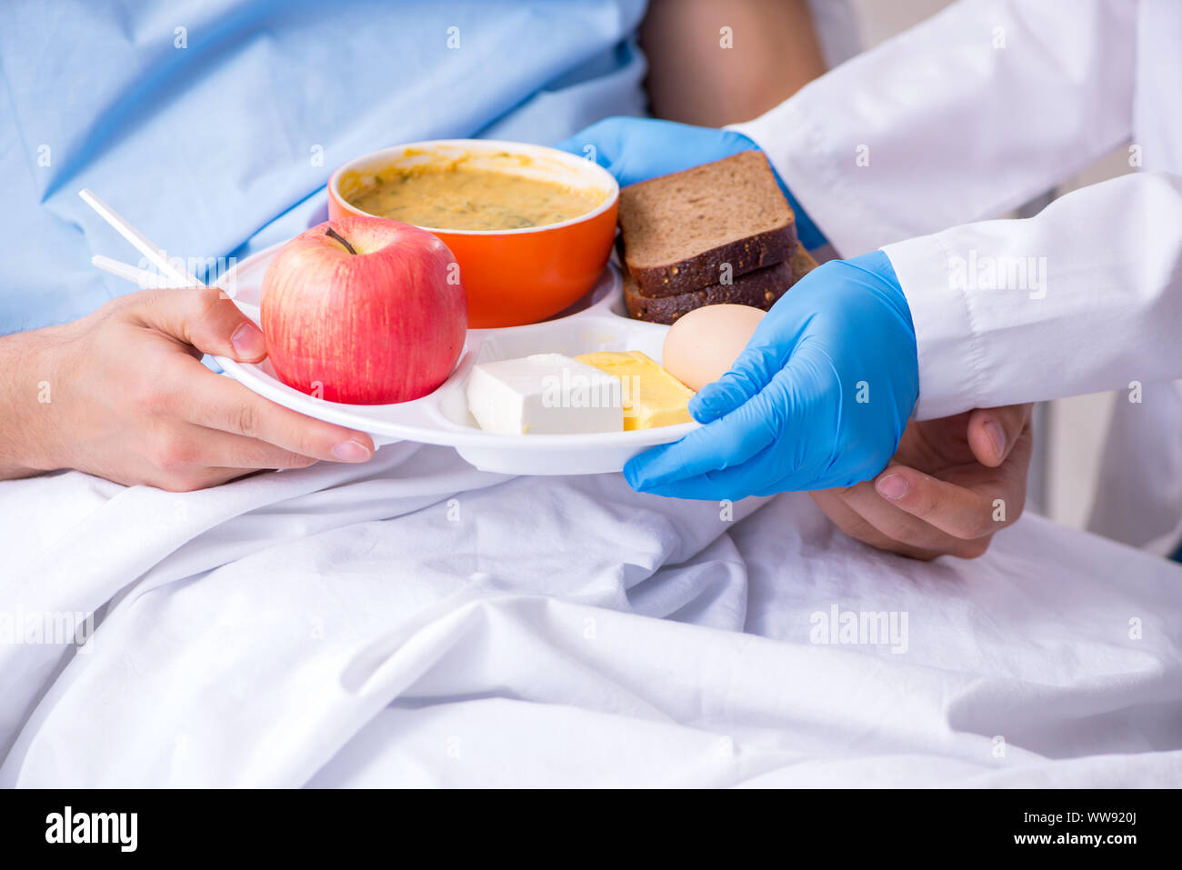 The male patient eating food in the hospital Stock Photo - Alamy