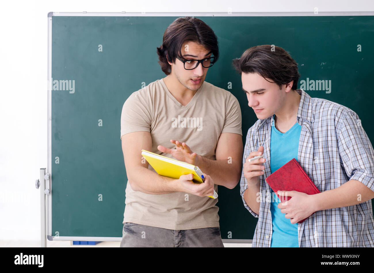 The two male students in the classroom Stock Photo - Alamy