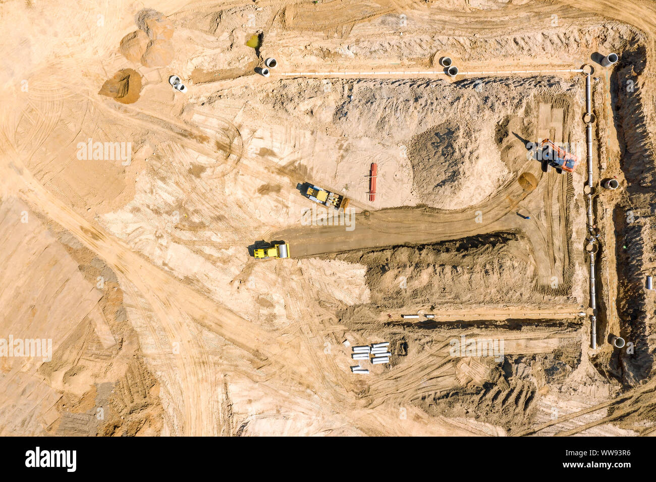 excavator, earthmover and compactor working at construction site ...