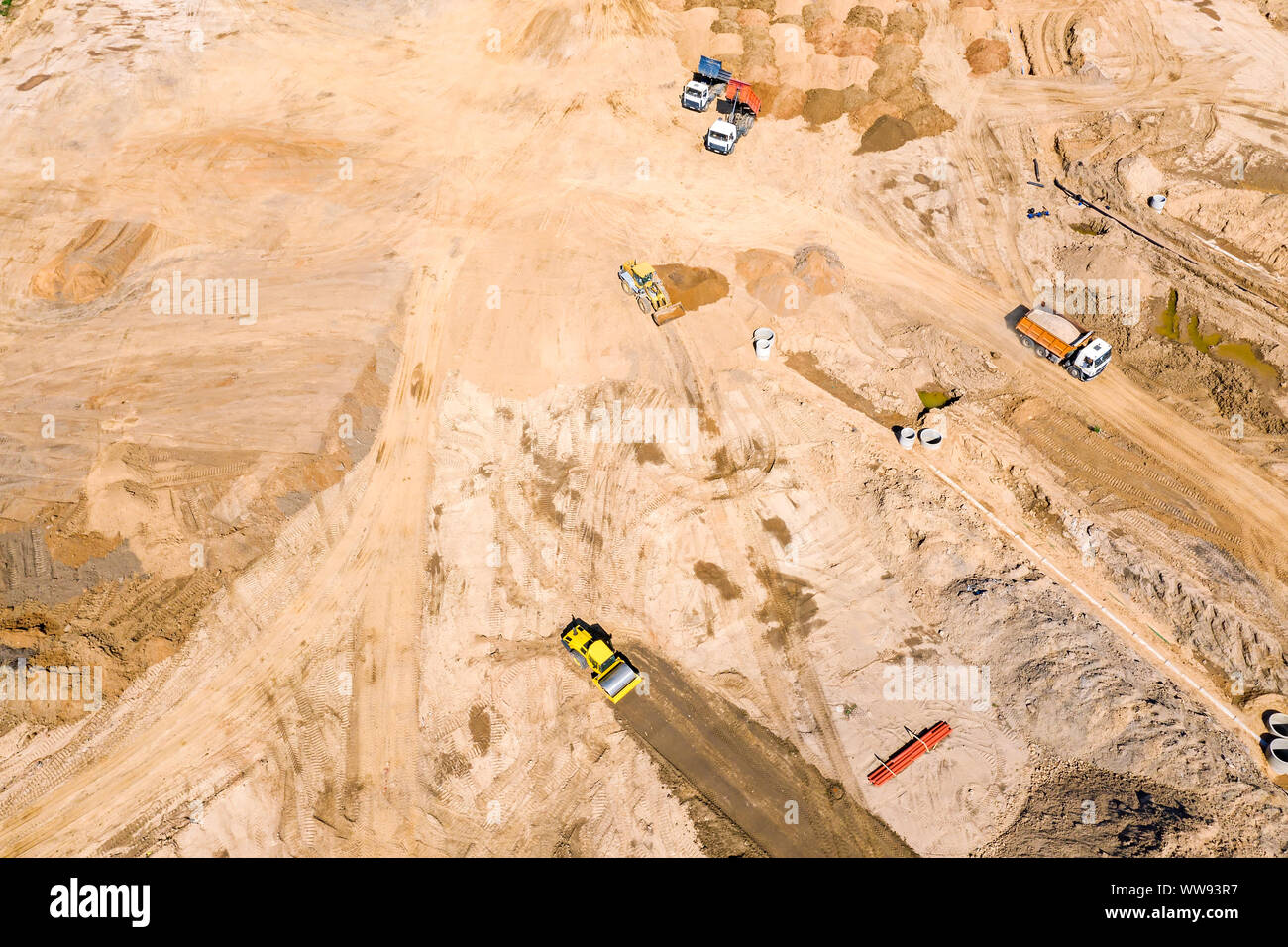 heavy industrial machines flattening the ground before future building ...