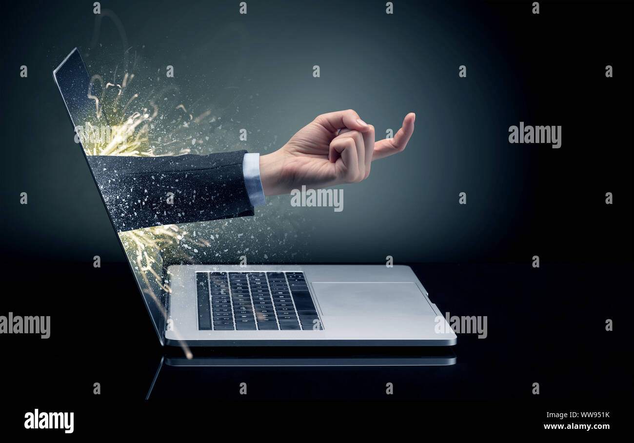 Hand coming out of a laptop with sparkling effects Stock Photo - Alamy