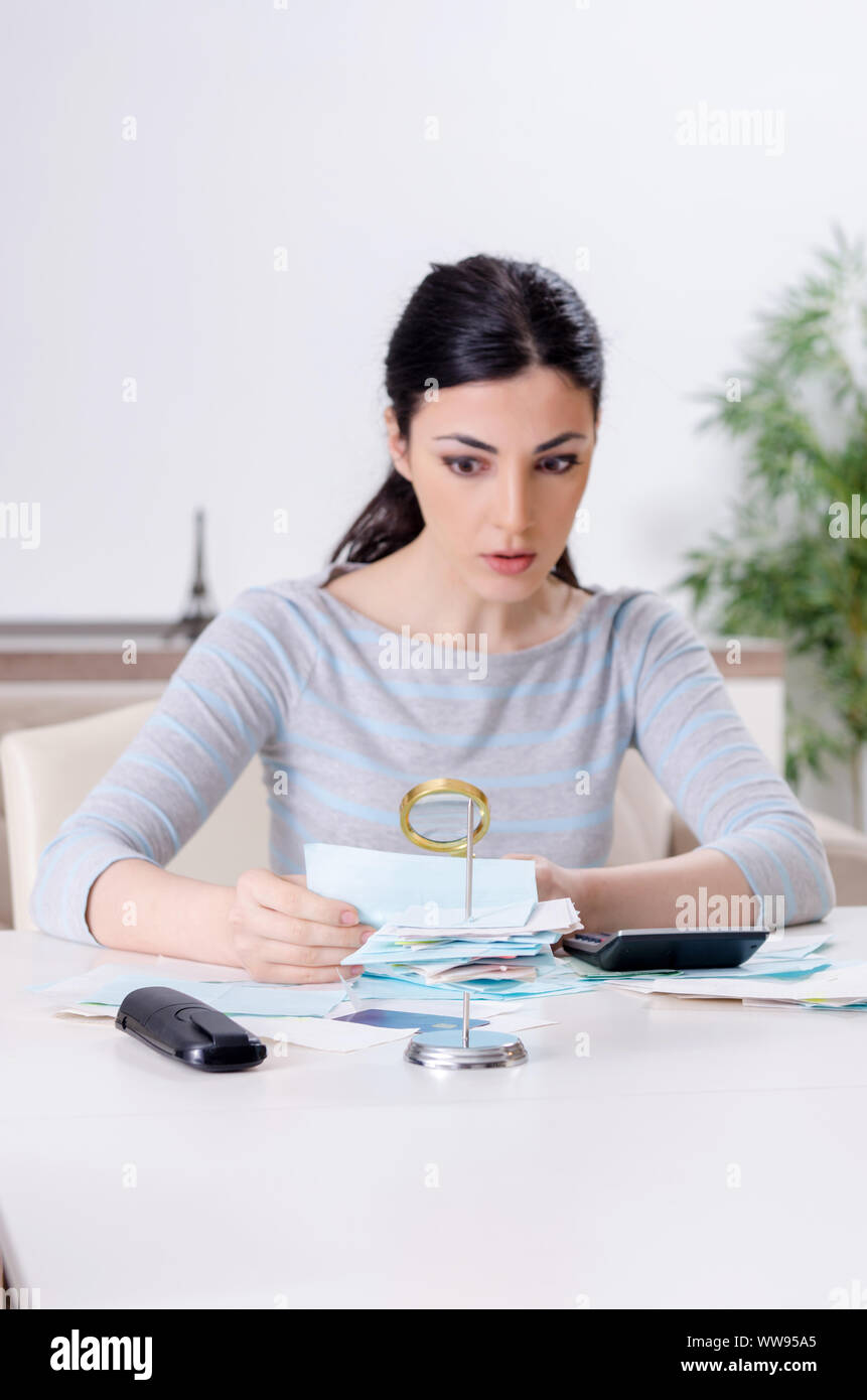 The young woman in budget planning concept Stock Photo - Alamy