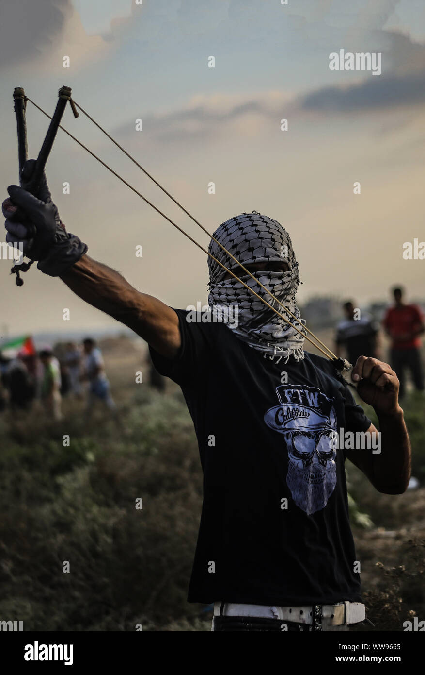 Gaza, Palestine. 13th Sep, 2019. A Palestinian demonstrator uses a ...