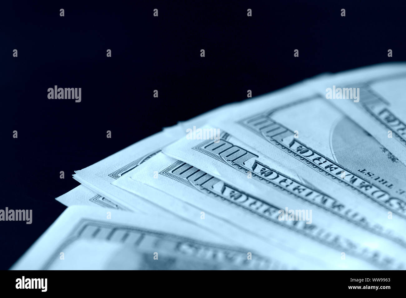 Hundred dollar bills close up blue color toned. Money background Stock ...