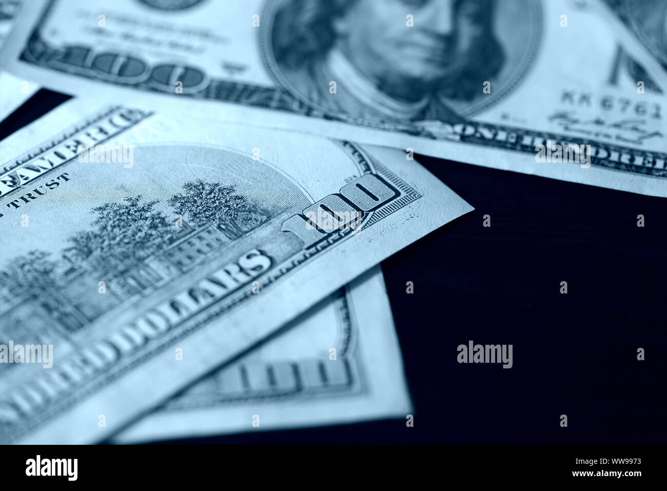 Hundred dollar bills close up blue color toned. Money background Stock ...