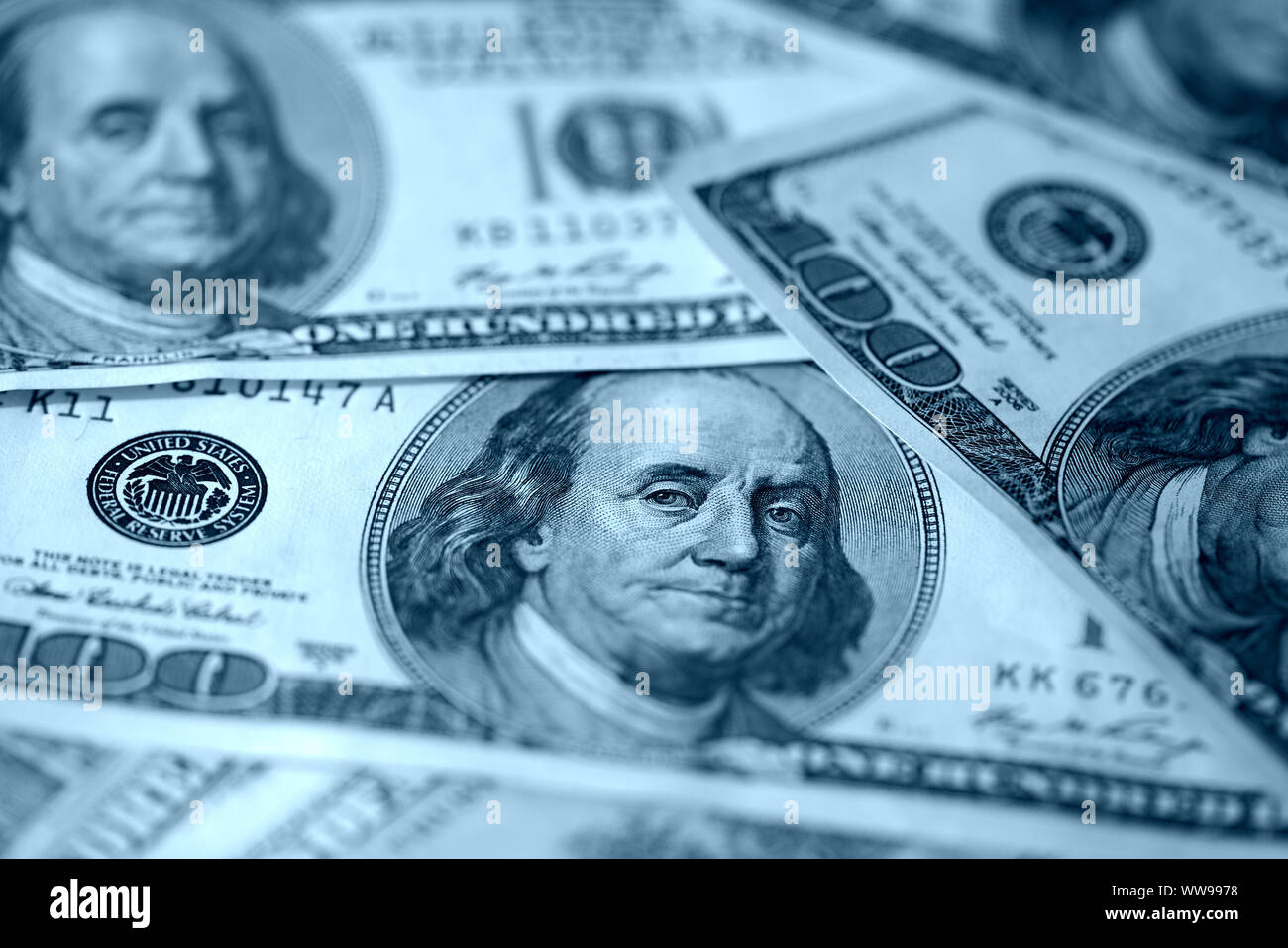 Hundred dollar bills close up blue color toned. Money background Stock ...