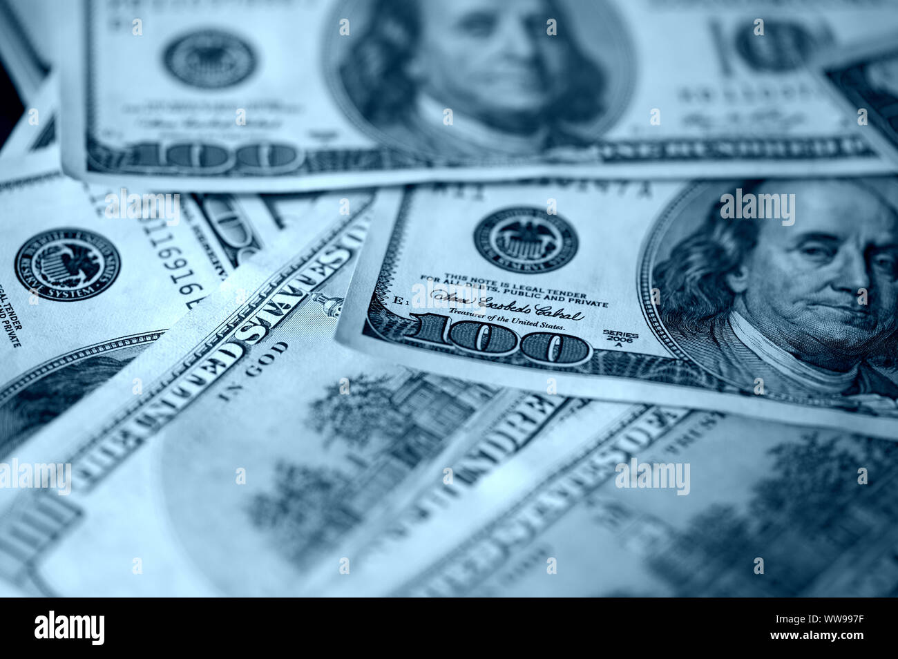 Hundred dollar bills close up blue color toned. Money background Stock ...