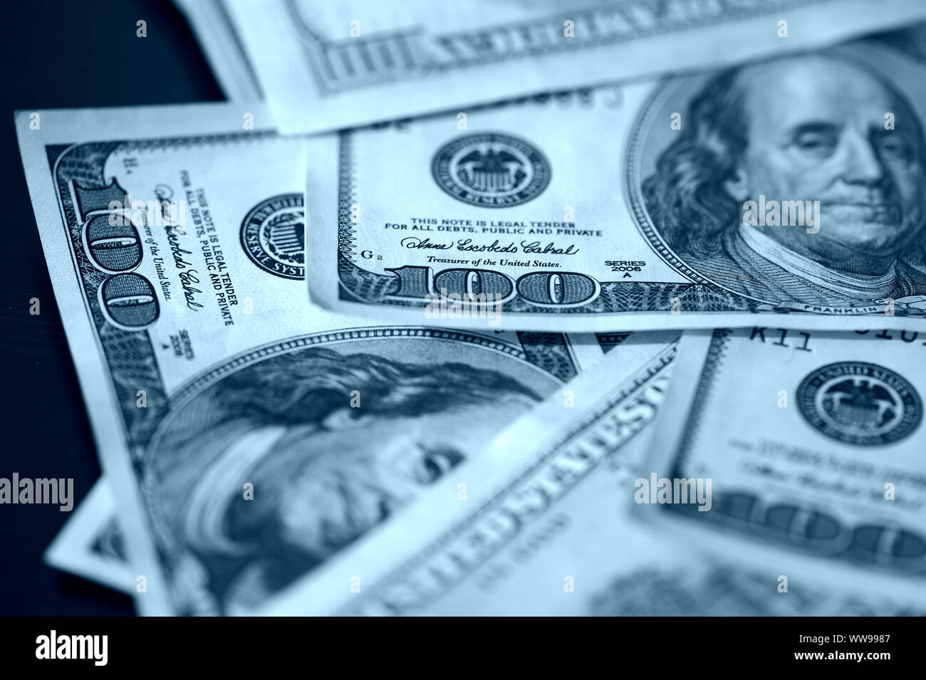 Hundred dollar bills close up blue color toned. Money background Stock ...