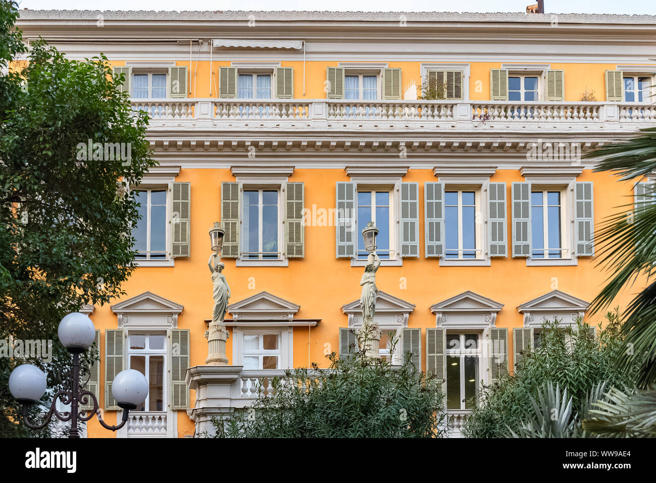 Nice, France, colorful facade, with typical windows and shutters, in a ...