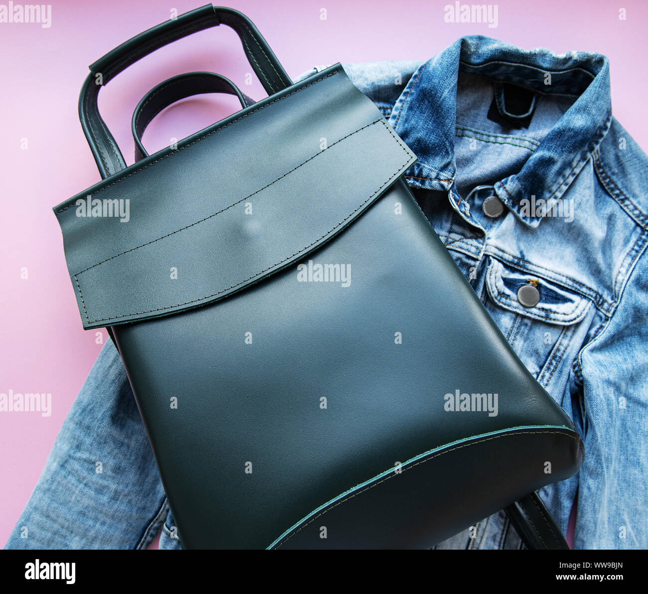 Green leather backpack and womens clothing, flat lay Stock Photo - Alamy