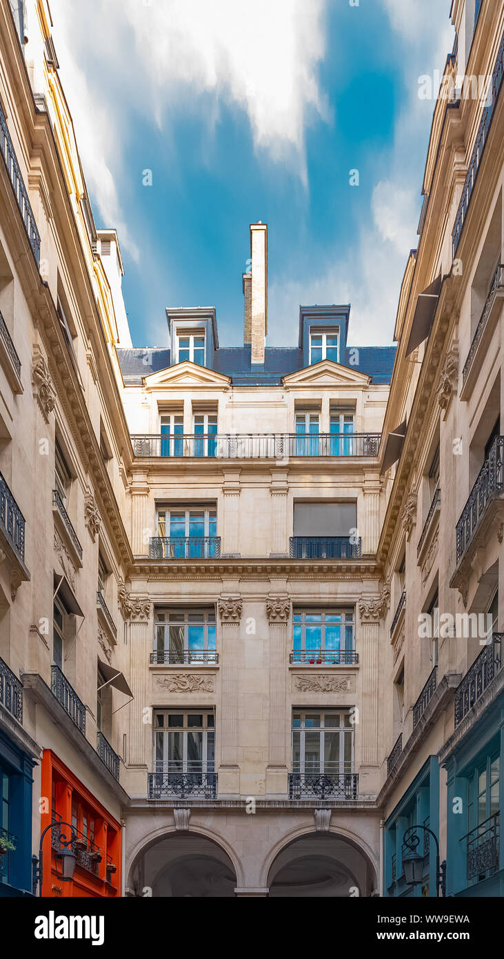 Paris, charming street and buildings, typical parisian facades in the ...