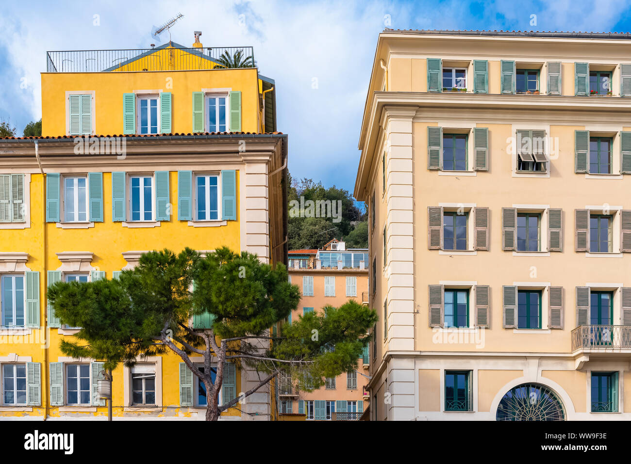 Nice, France, colorful facade, with typical windows and shutters, in a ...