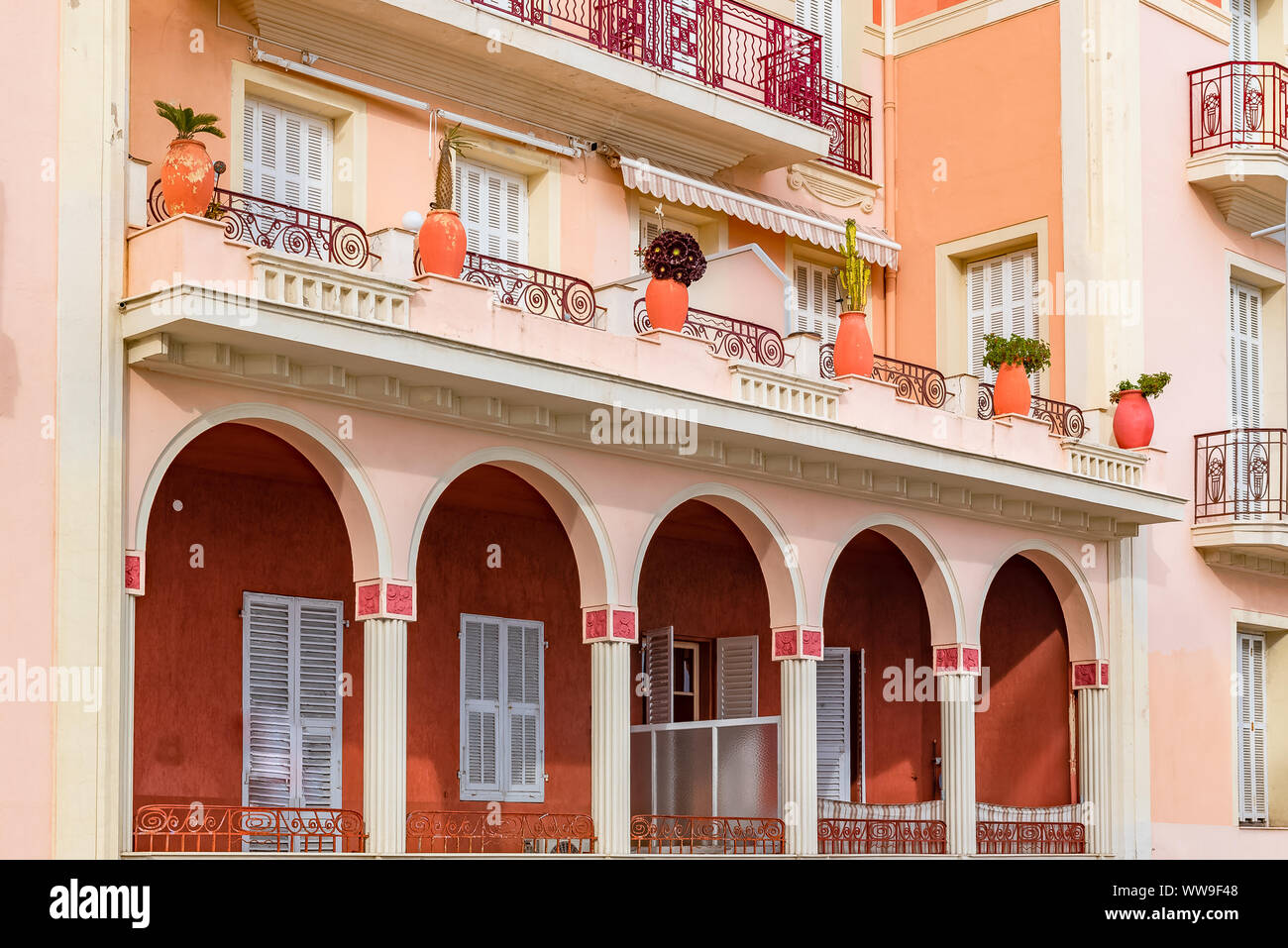 Nice, France, colorful facade, with typical windows and shutters, in a ...