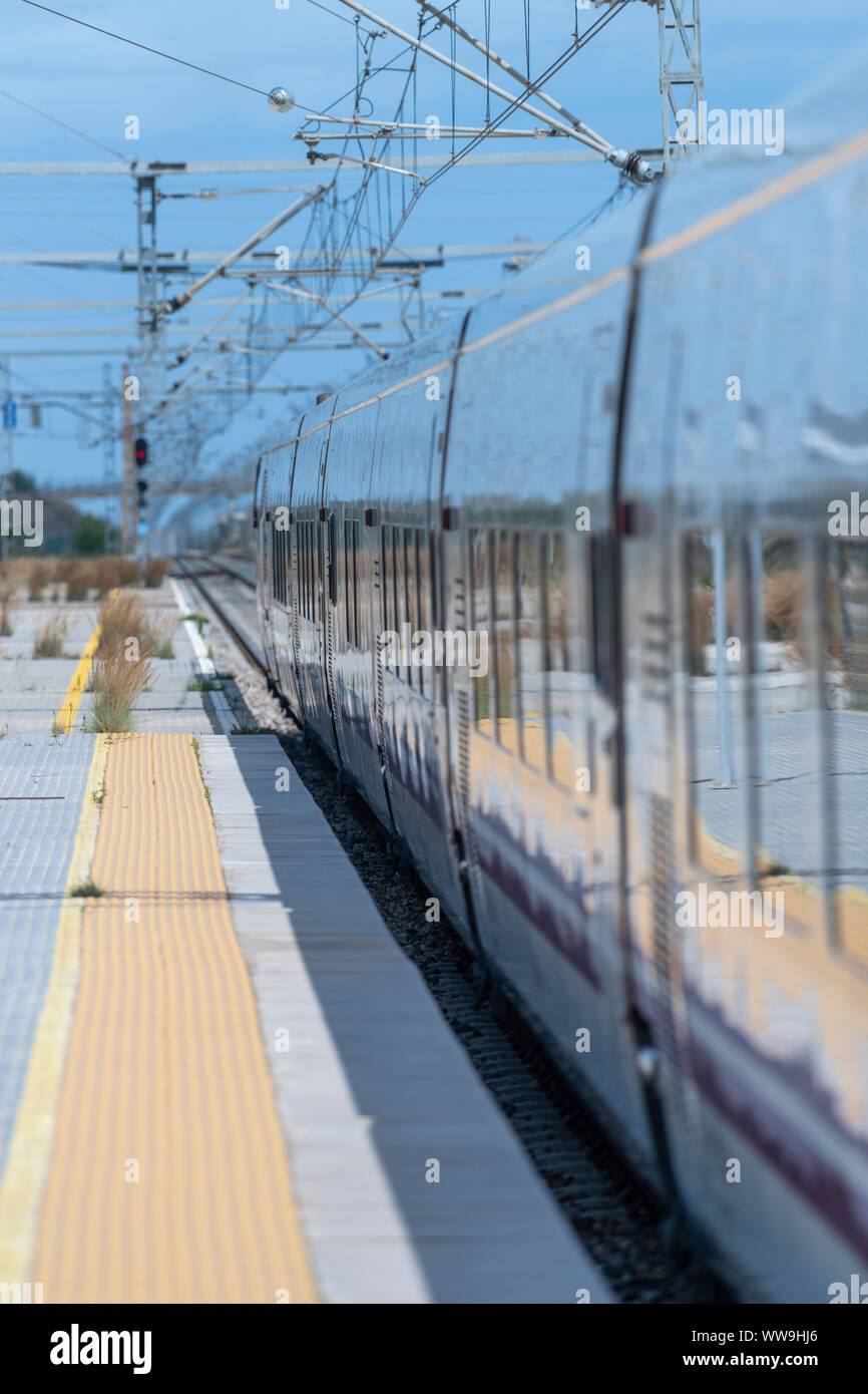 Train profile with background wire fence and background blue sky Stock ...