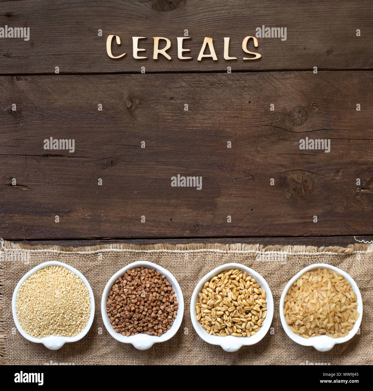 Cereals in bowls border with word Cereals on wood Stock Photo - Alamy