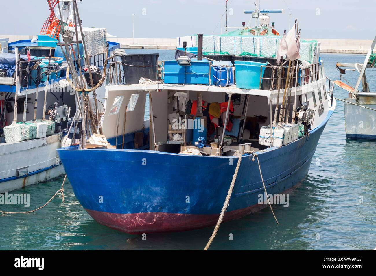 Red fishing boats hi-res stock photography and images - Alamy