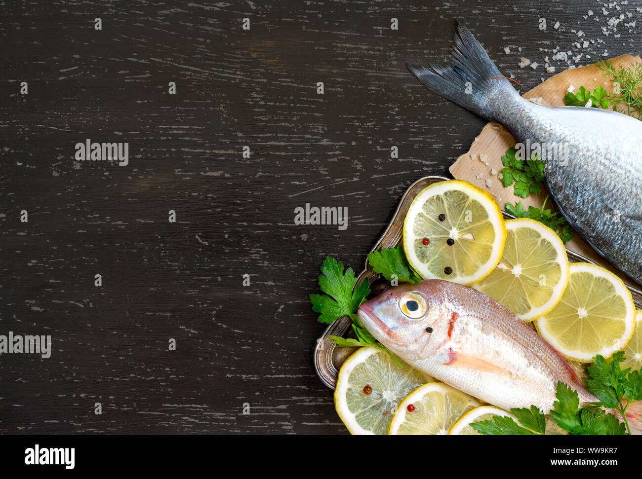 Fresh fish on a dark vintage background Stock Photo - Alamy