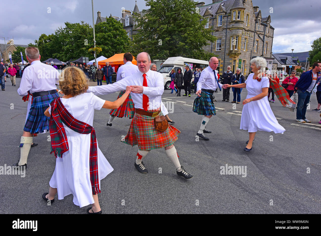 Scottish traditional country Dancers performing in the town square in ...