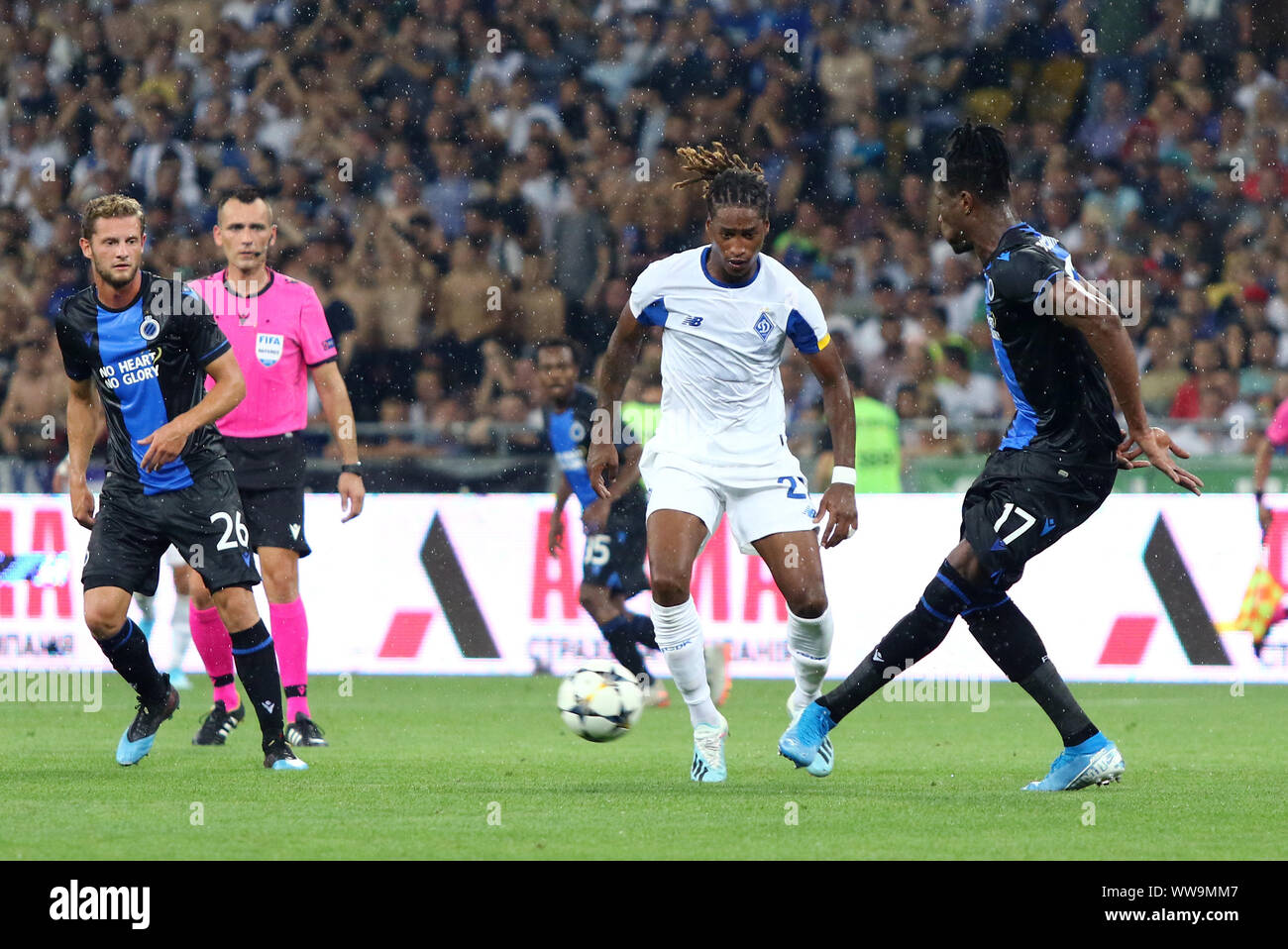 KYIV, UKRAINE - August 13, 2019: Simon Deli of Club Brugge (R) fights ...
