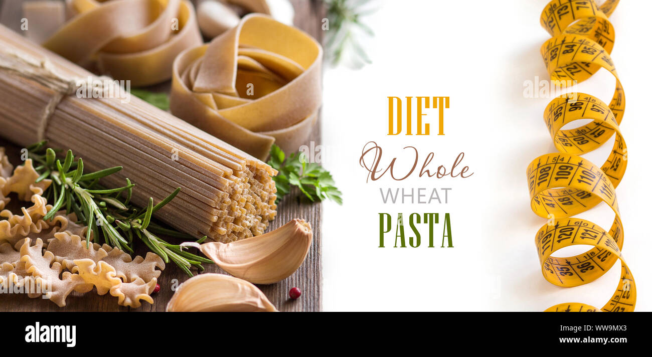 Whole wheat italian pasta, garlic, herbs and measuring tape Stock Photo ...