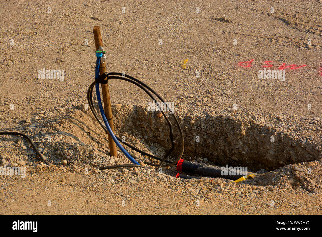 excavation pit with water connection, black Plastic pipes on the ...