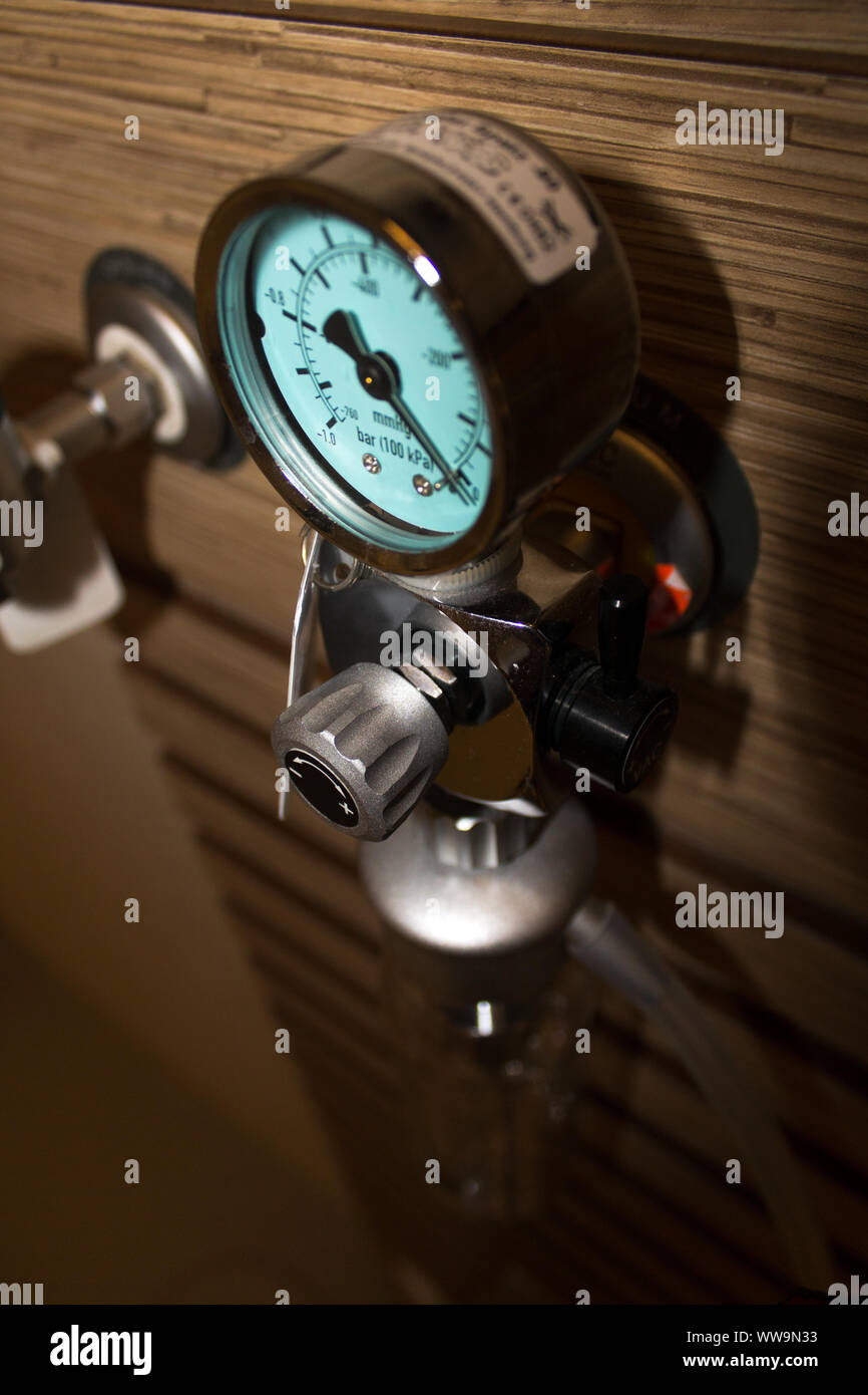 Selective focus on the pressure gauge of an oxygen support system ...