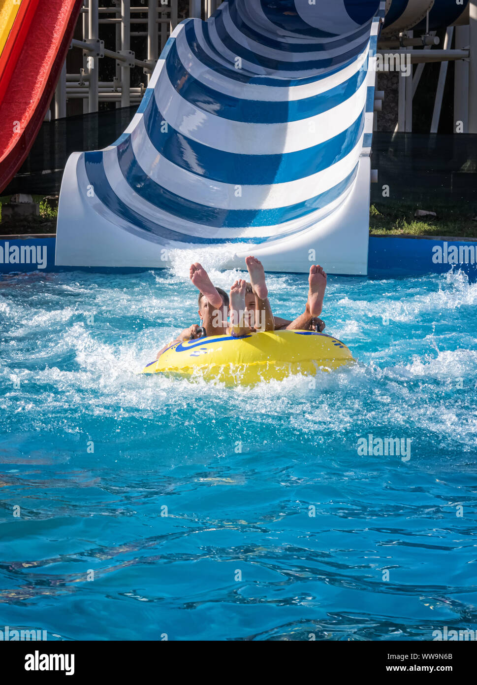 Blue waterslide in waterpark hi-res stock photography and images - Alamy