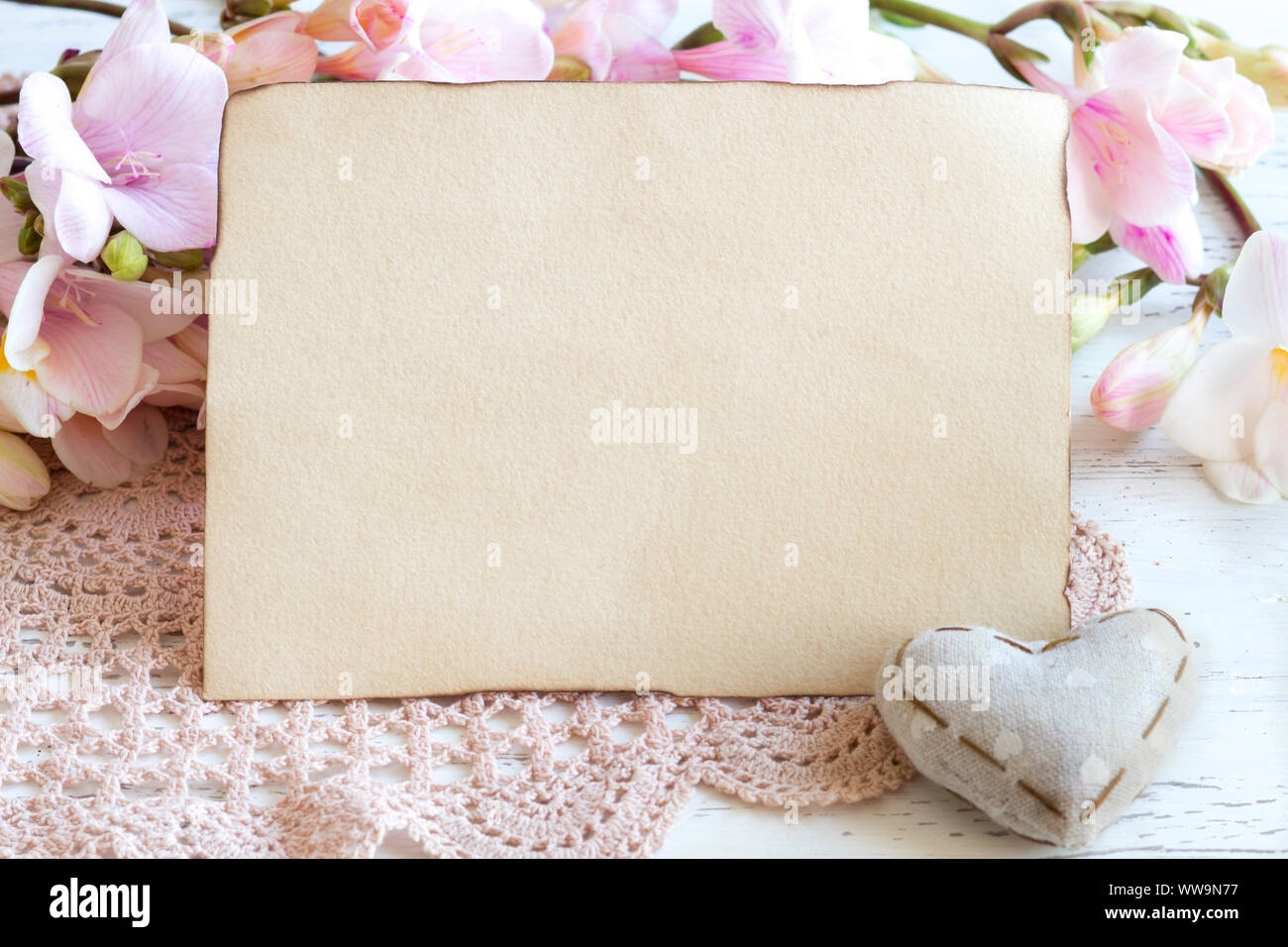 Shabby spring paper background with freesia flowers and heart Stock ...