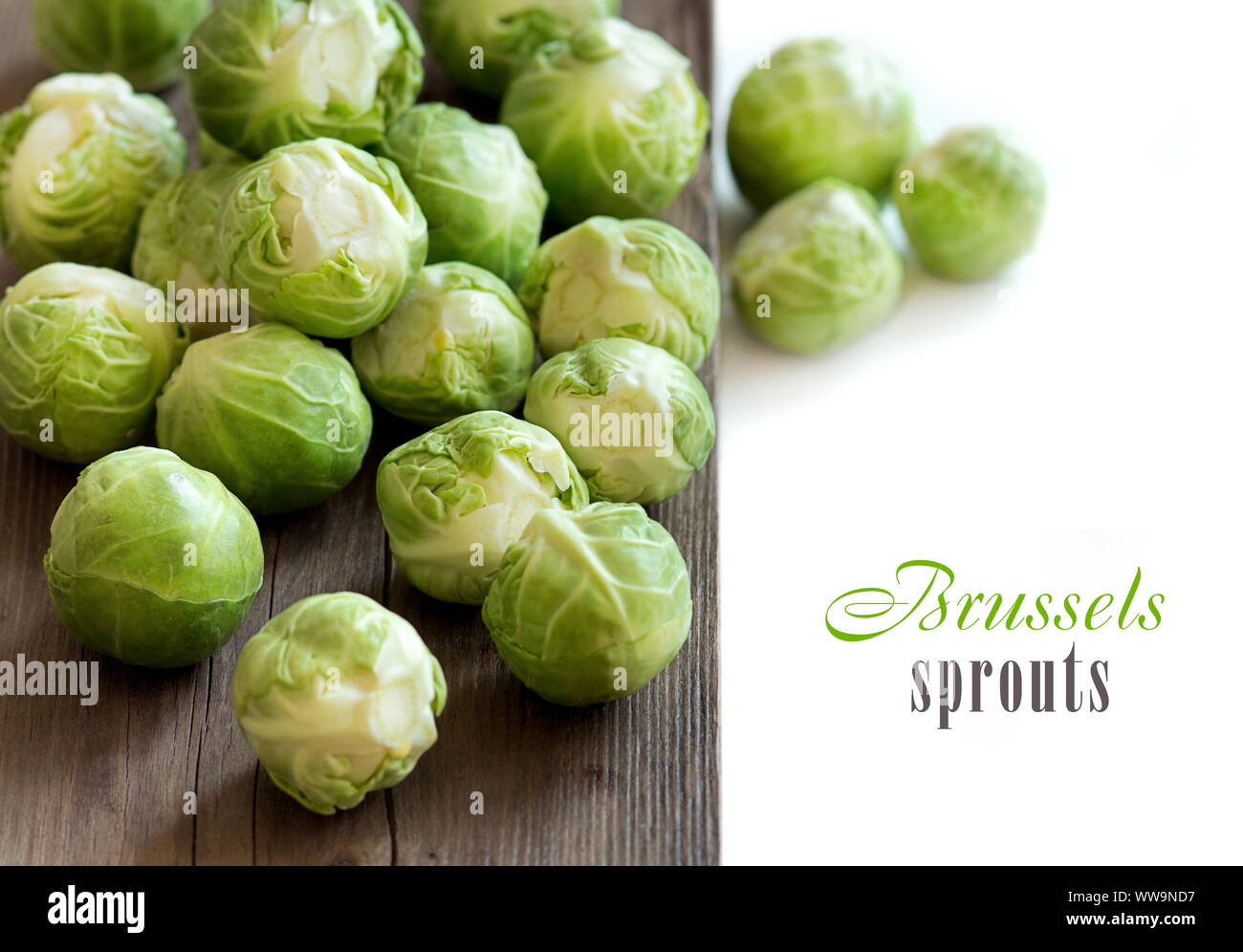 Brussels sprouts on an old wooden table border Stock Photo - Alamy