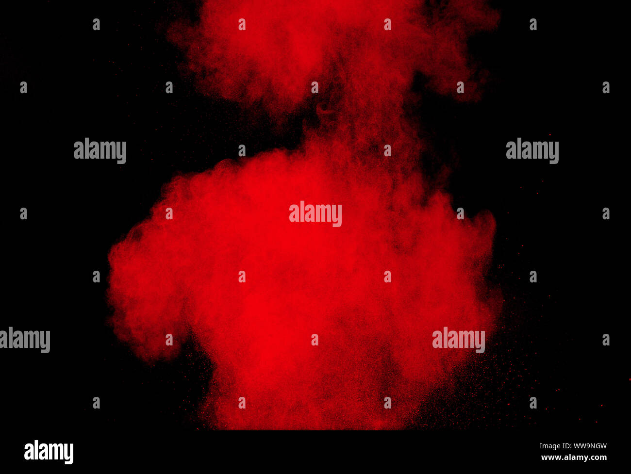 Red powder explosion cloud on black background. Freeze motion of red ...