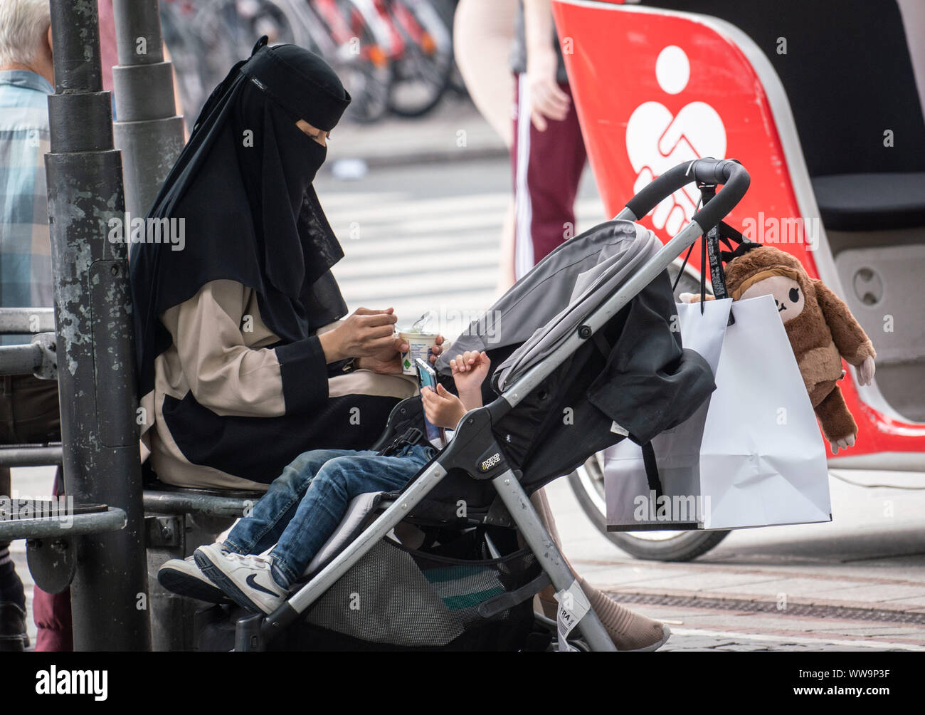 10 August 2019, Hessen, Frankfurt/Main: A Muslim woman wears a niqab, a ...