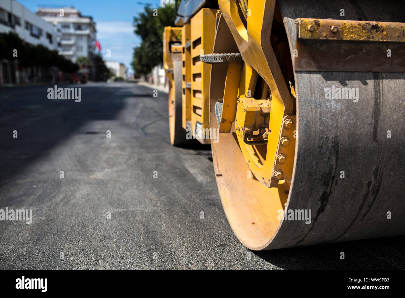 Close view on the road roller working on the new road construction site ...