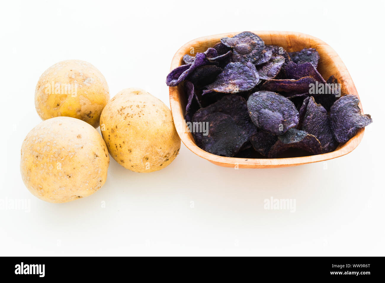 A Heap of purple potato chips on white background Stock Photo - Alamy