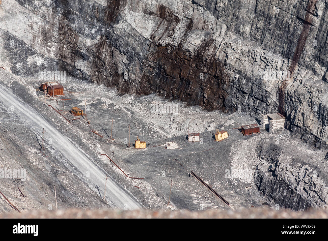 Bottom of open pit with small abandoned buildings and structures Stock ...