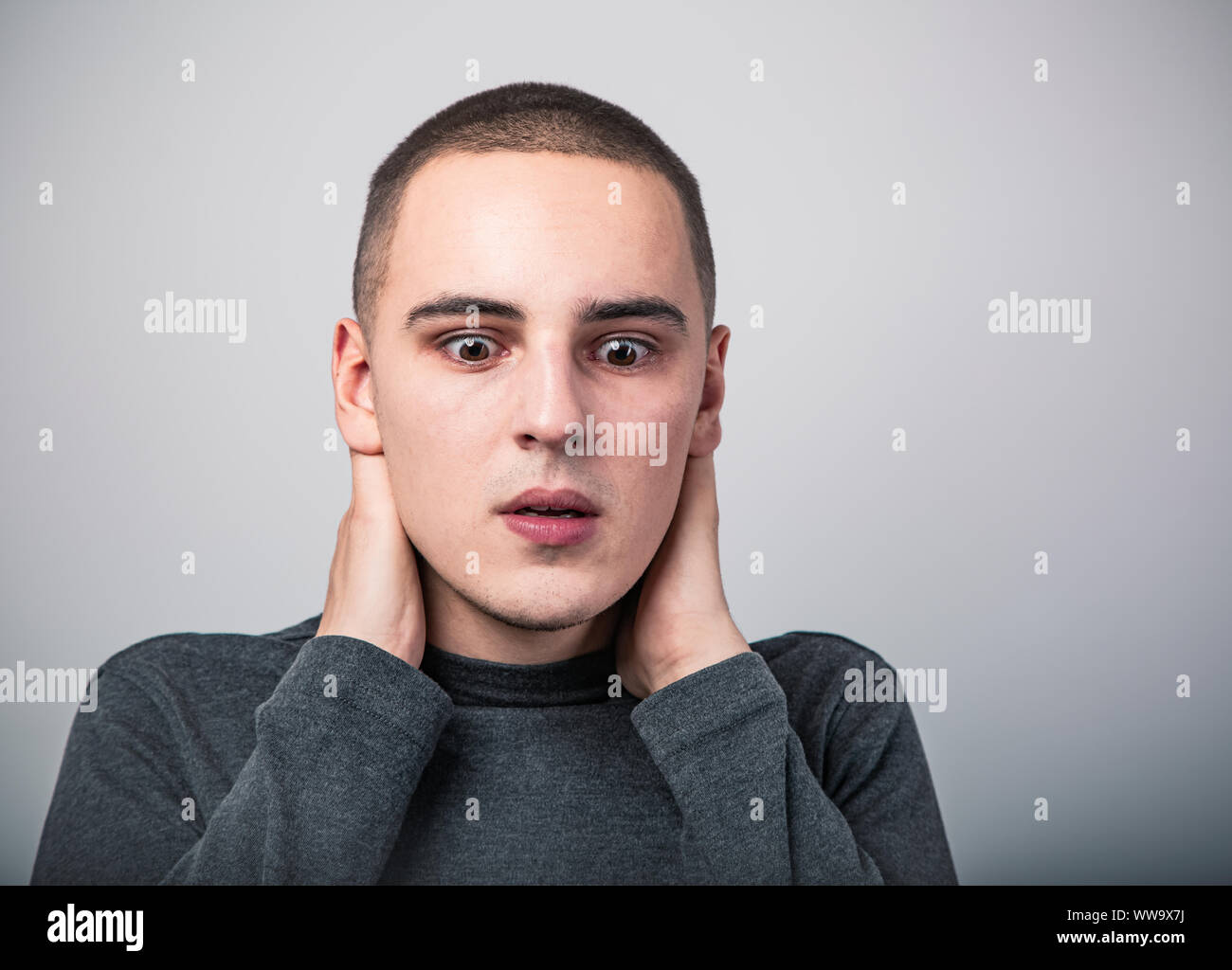 Shocked crying man with dropping tears on the face with headache ...