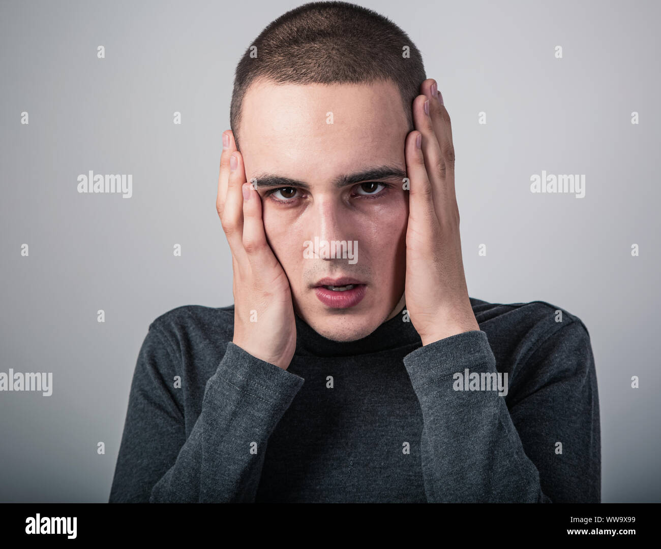 Unhappy crying man with dropping tears on the face with headache ...