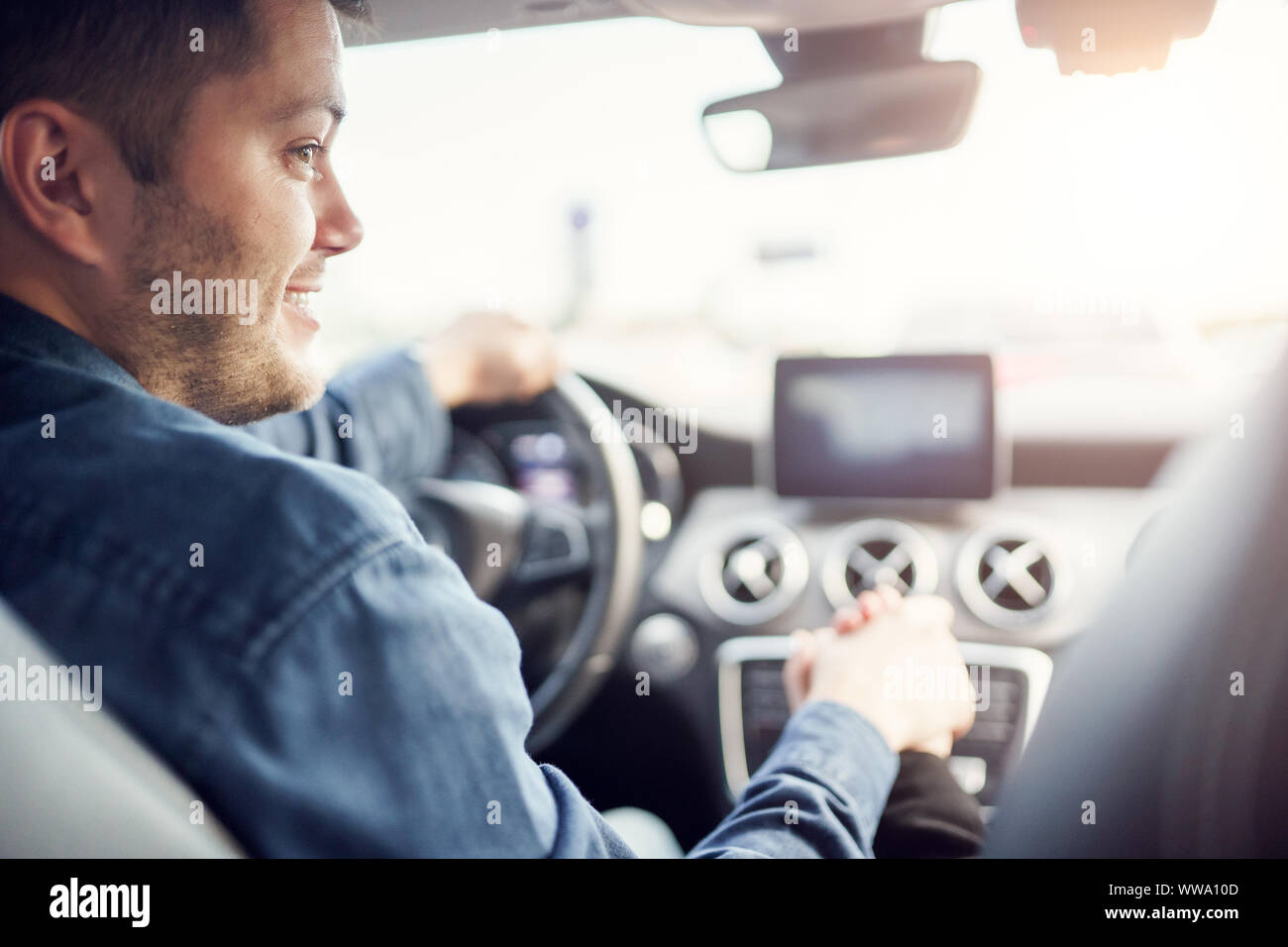 Picture of driver man and girl sitting in front seat of car during day ...