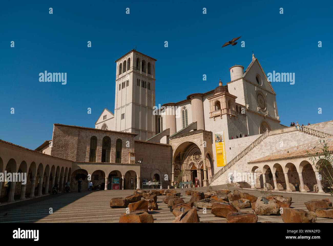 Assisi Basilica view from the lower square on a blue sky Stock Photo ...