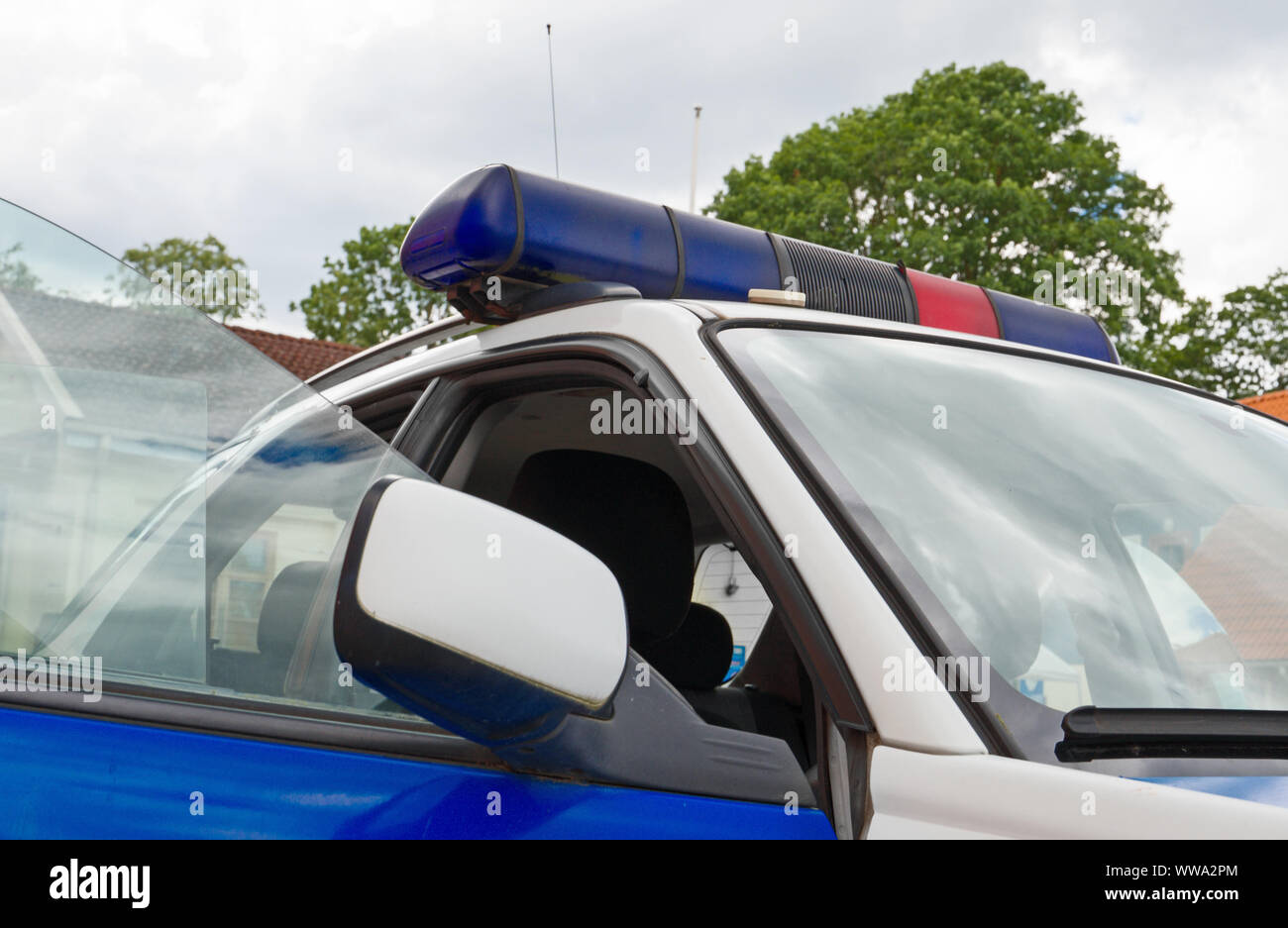 Police car with light bars on the street. Close-up view Stock Photo - Alamy