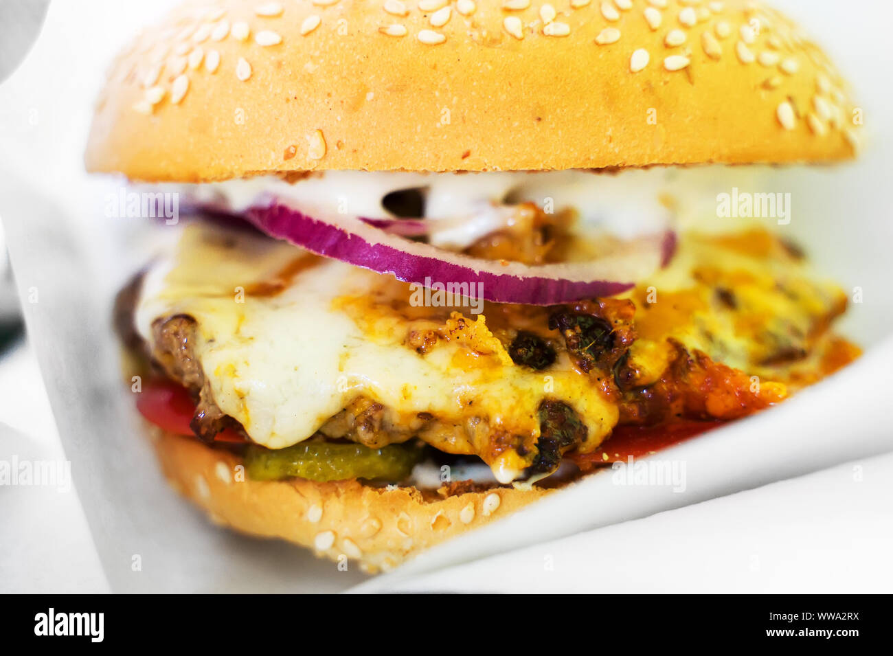 Fast food. A juicy freshly cooked burger Stock Photo - Alamy